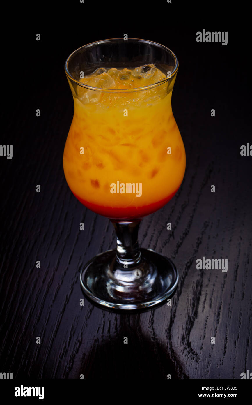 Sweet glass of Tequila Sunrise cocktail Stock Photo - Alamy