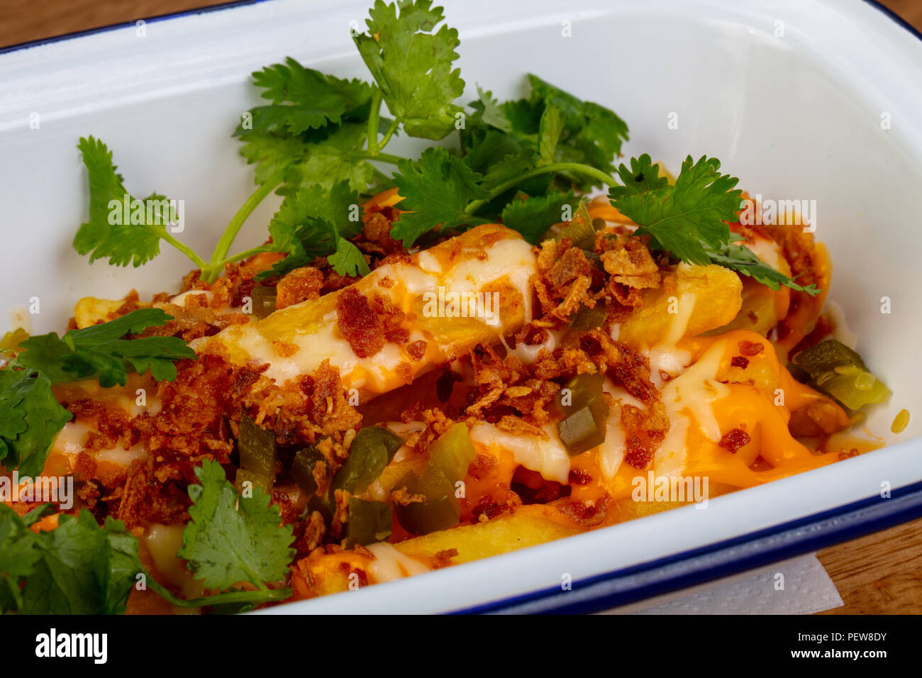 French fry with cheese sauce Stock Photo - Alamy