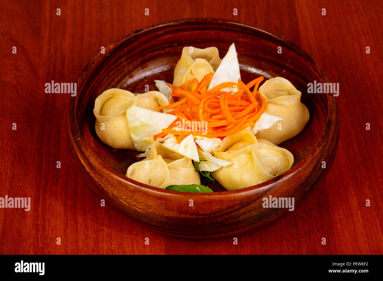 Uzbek traditional dumplings - Manti with meat Stock Photo - Alamy