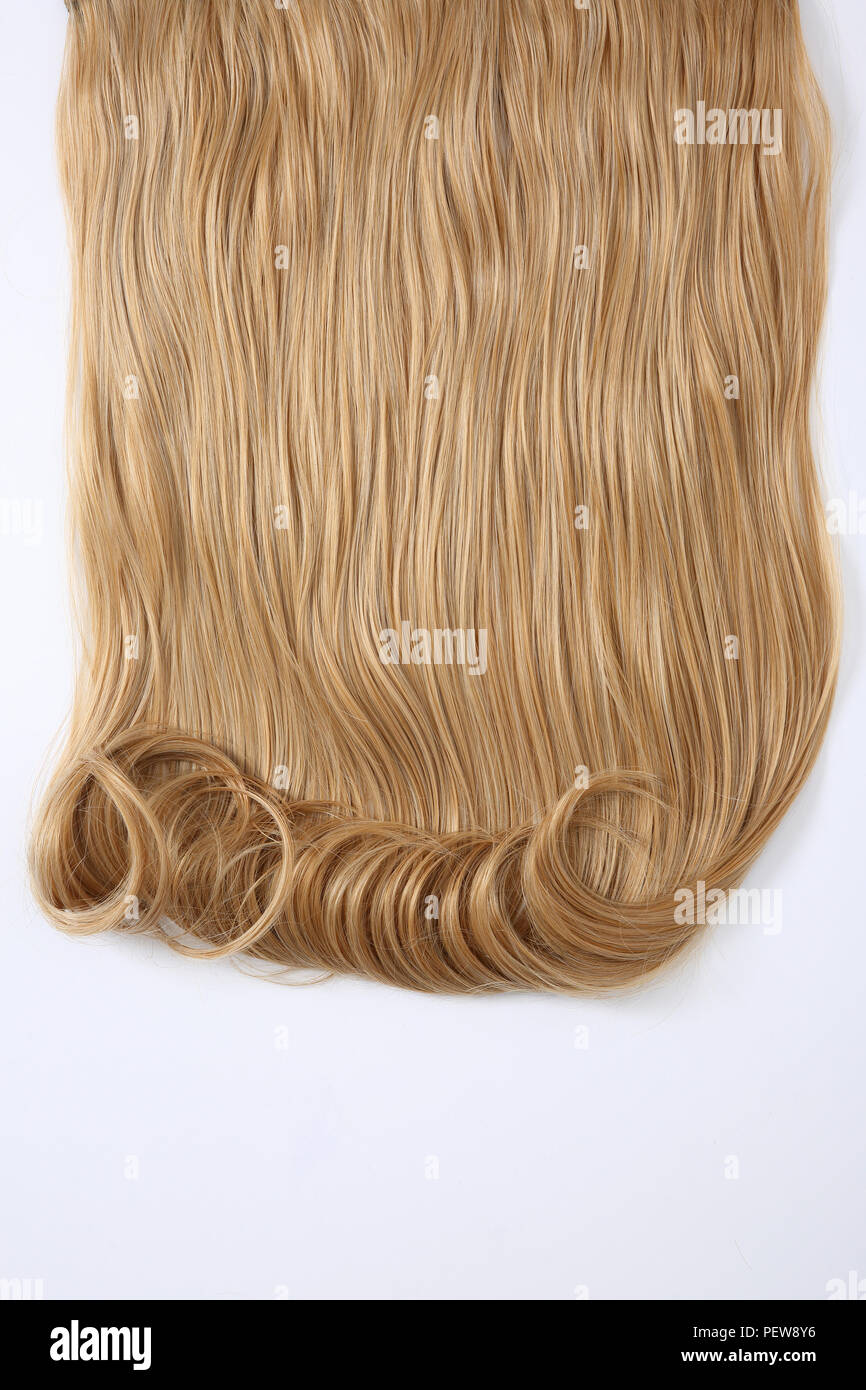 Long colorful hair with objects related to hair salon on close up ...