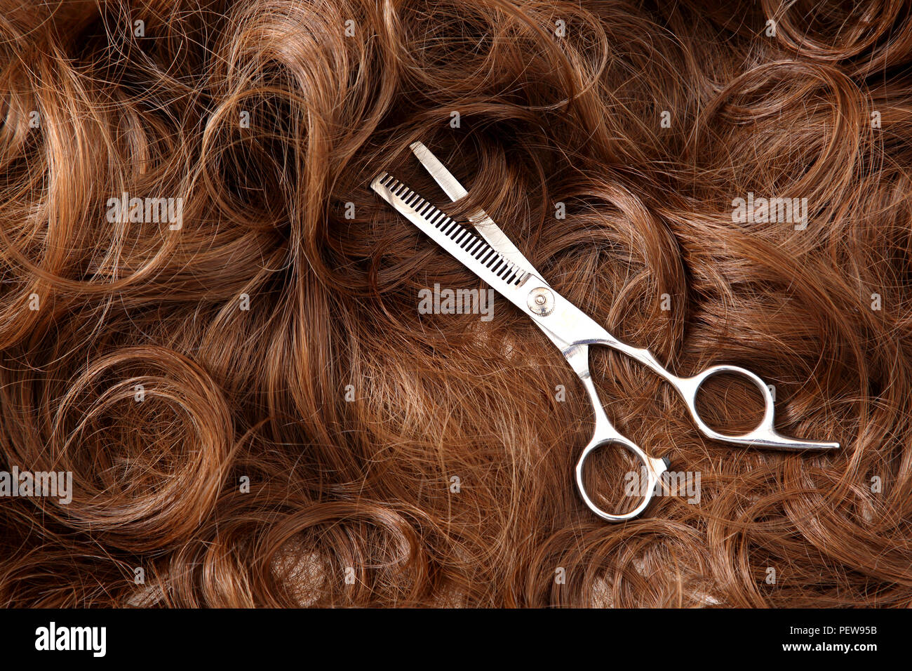 Long colorful hair with objects related to hair salon on close up ...