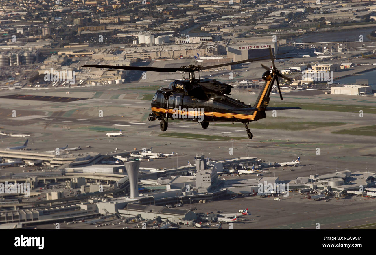 A U.S. Customs and Border Protection Black Hawk helicopter flies over ...