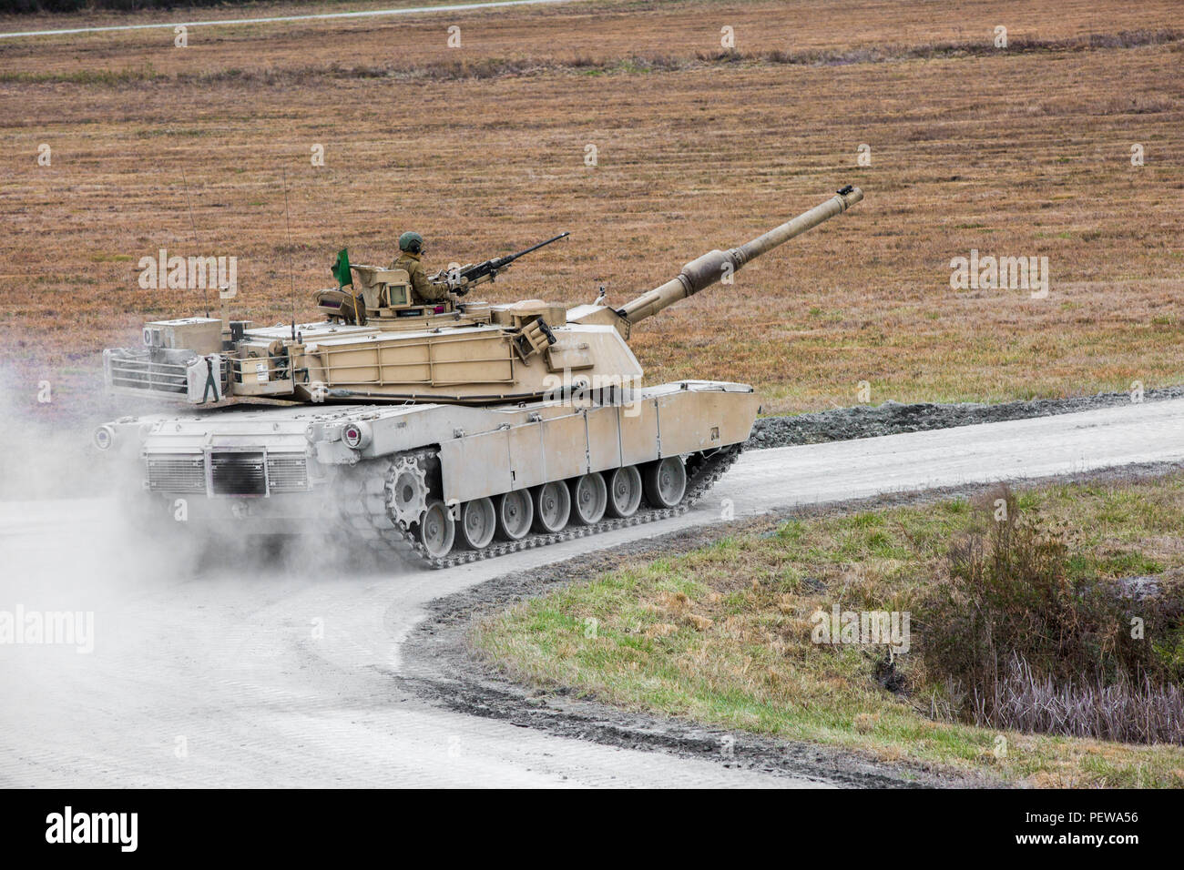 U.S. Marines with Company B, 2nd Tank Battalion, maneuver an M1A1 ...