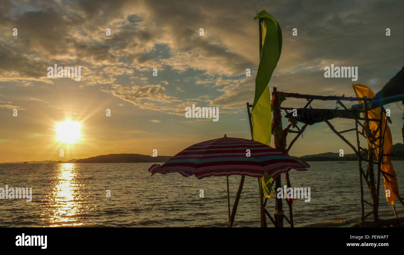 Landscape view of a sunset over the Krabi beach, with colorful ...