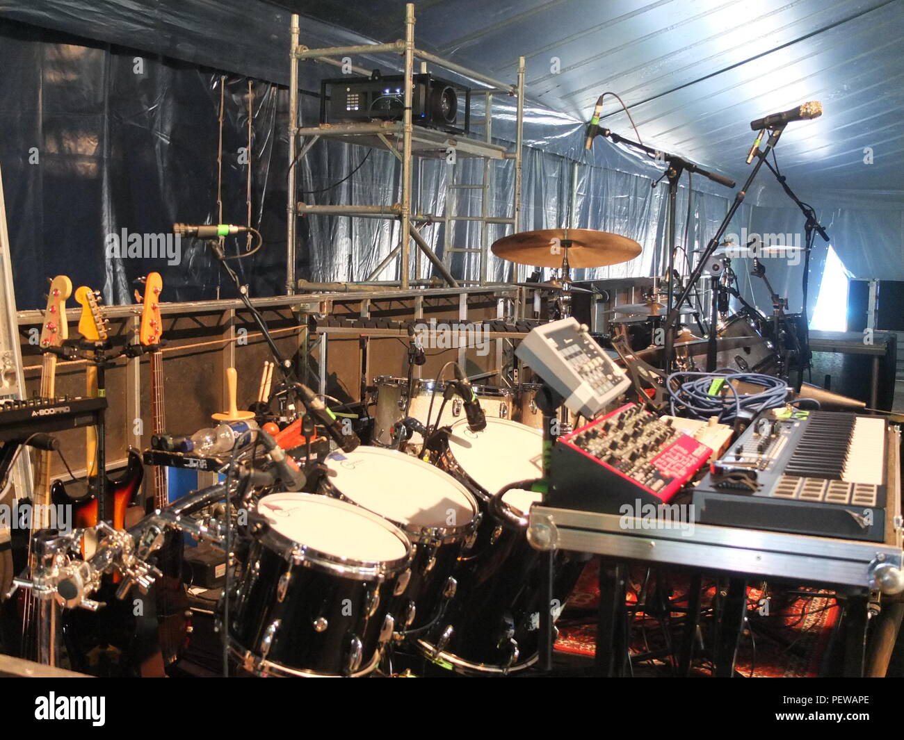 Instruments belong to various bands lined up backstage at a UK rock ...