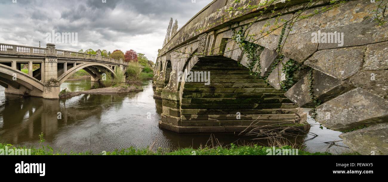The old bridge and Atcham Bridge over the River Severn in Atcham, near ...
