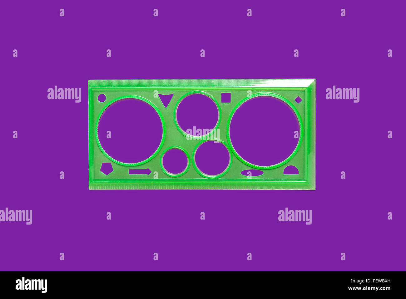 green ruler isolated on the purple surface Stock Photo - Alamy