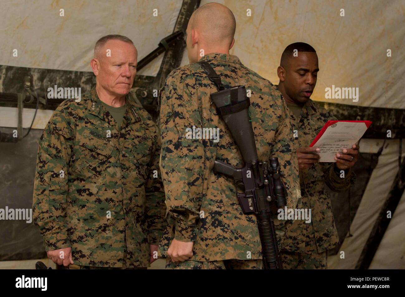 U.S. Marines stand at attention while Sgt. Maj. Devon A. Lee, Camp ...