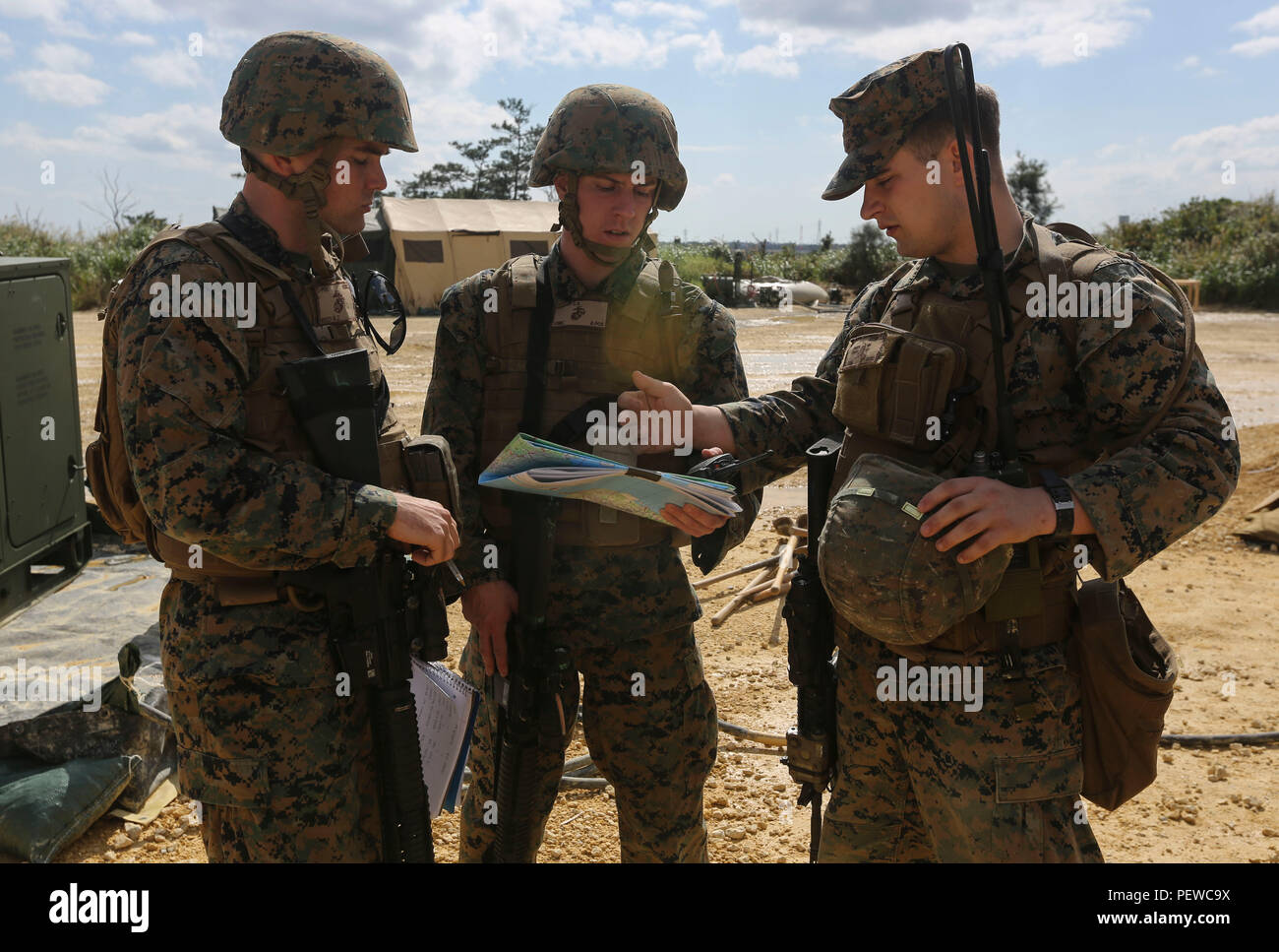 U.S. Marines with 3D Marine Headquarters Group look at a map before a ...