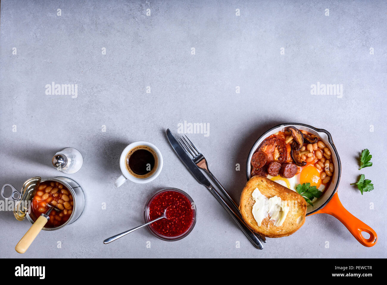 Traditional English Breakfast Food on the table eggs ,sausages, beans ...