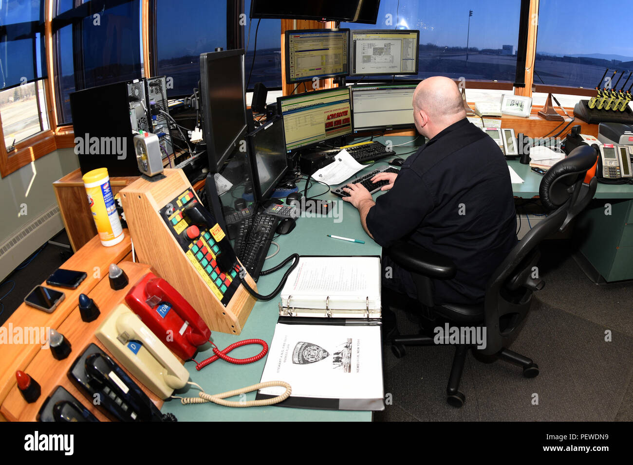 Civilian Firefighter Spencer Slayton, 105th Fire Department, sorts ...