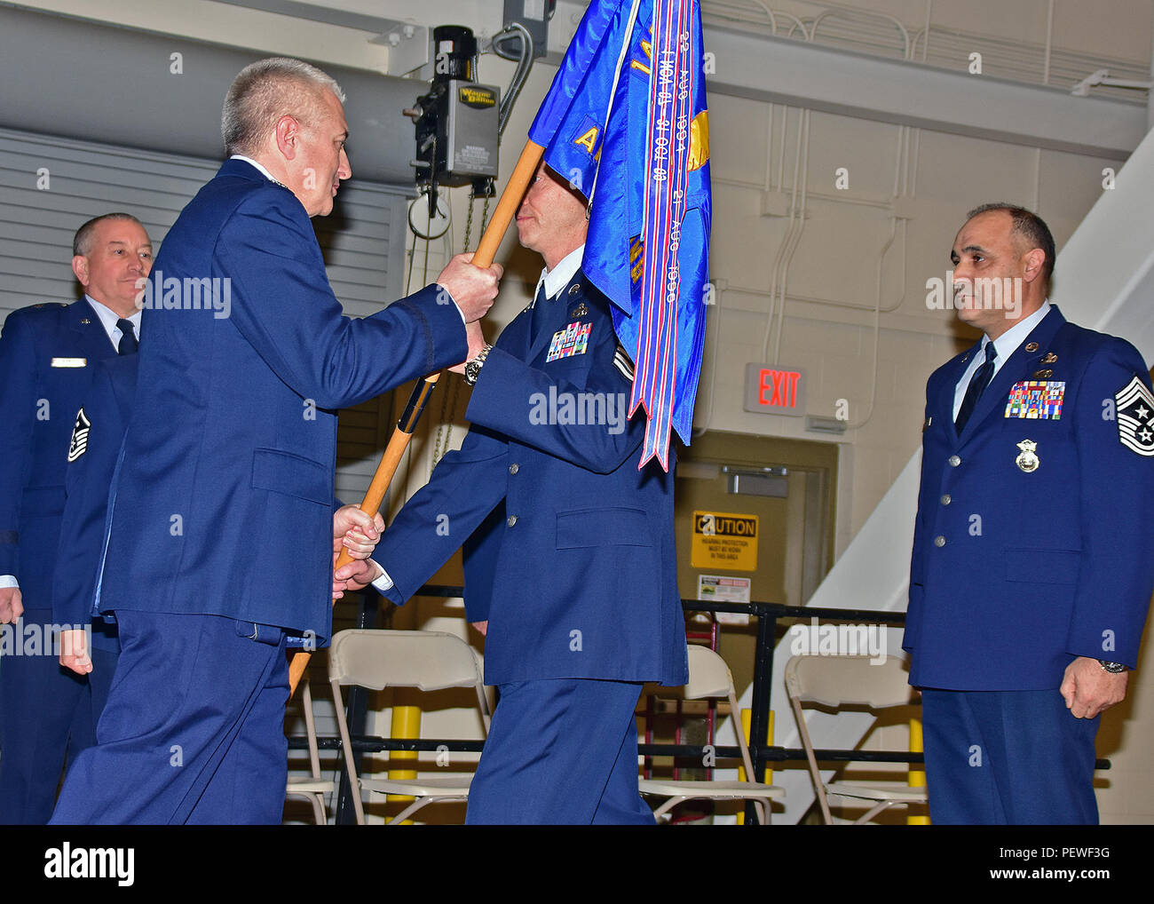 Chief Master Sgt. Gregory Houghton receives the guidon from Col. Daniel ...