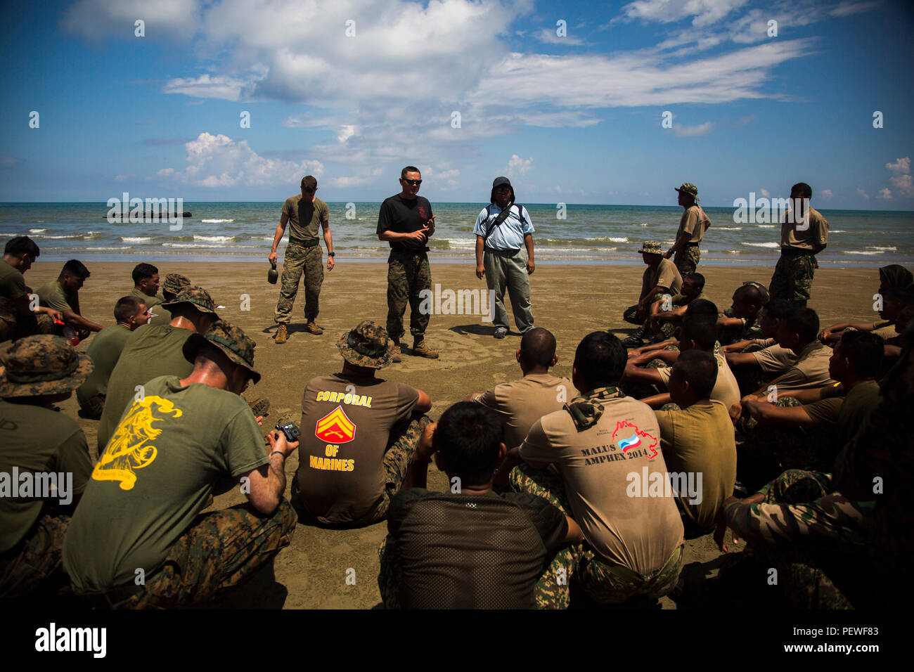 U.S. Marine Corps Staff Sgt. David Stephens, center, a platoon sergeant ...