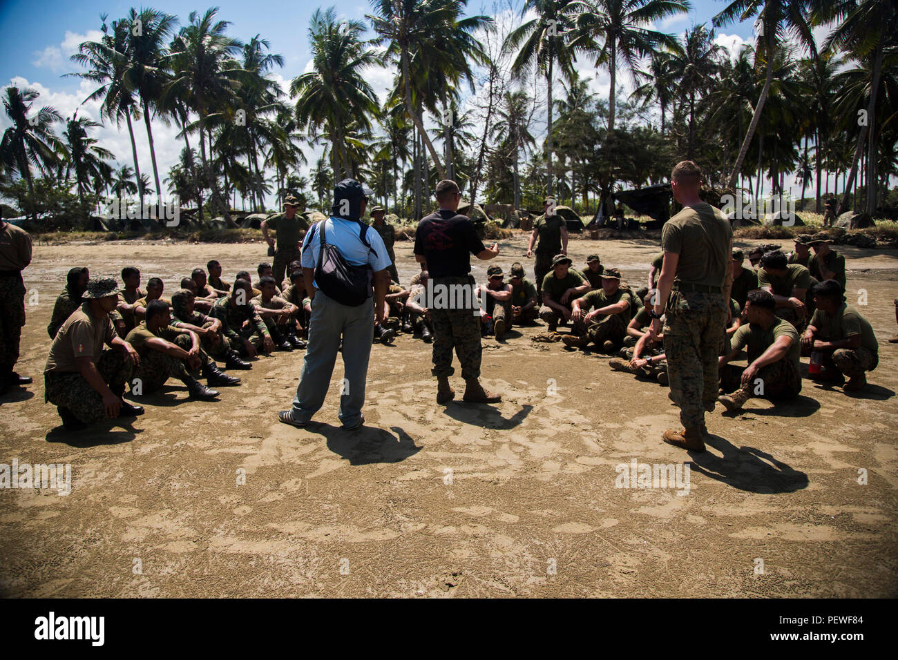 U.S. Marine Corps Staff Sgt. David Stephens, center, a platoon sergeant ...