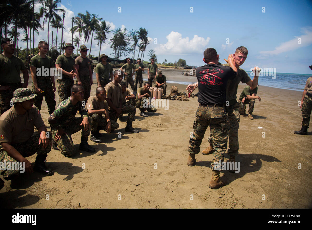 U.S. Marine Corps Staff Sgt. David Stephens, right, a platoon sergeant ...
