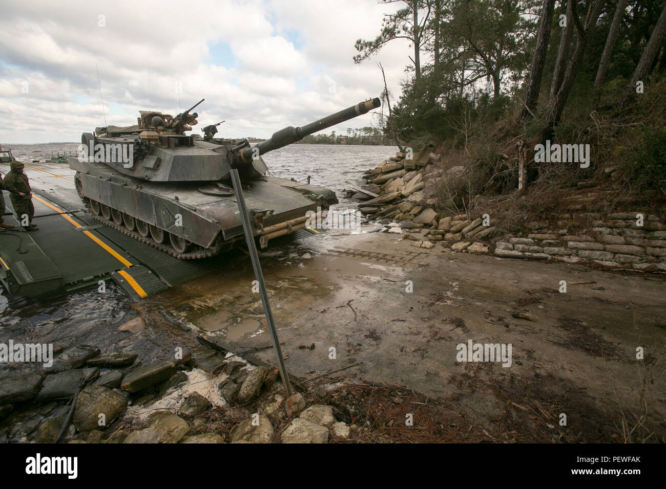 Marines with Bridge Company, 8th Engineer Support Battalion, roll an ...