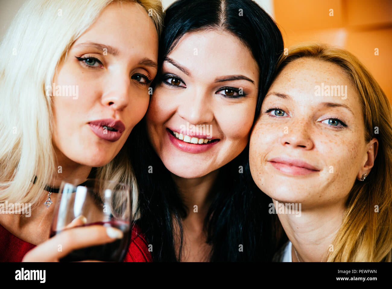Three friends taking portrait together Stock Photo - Alamy