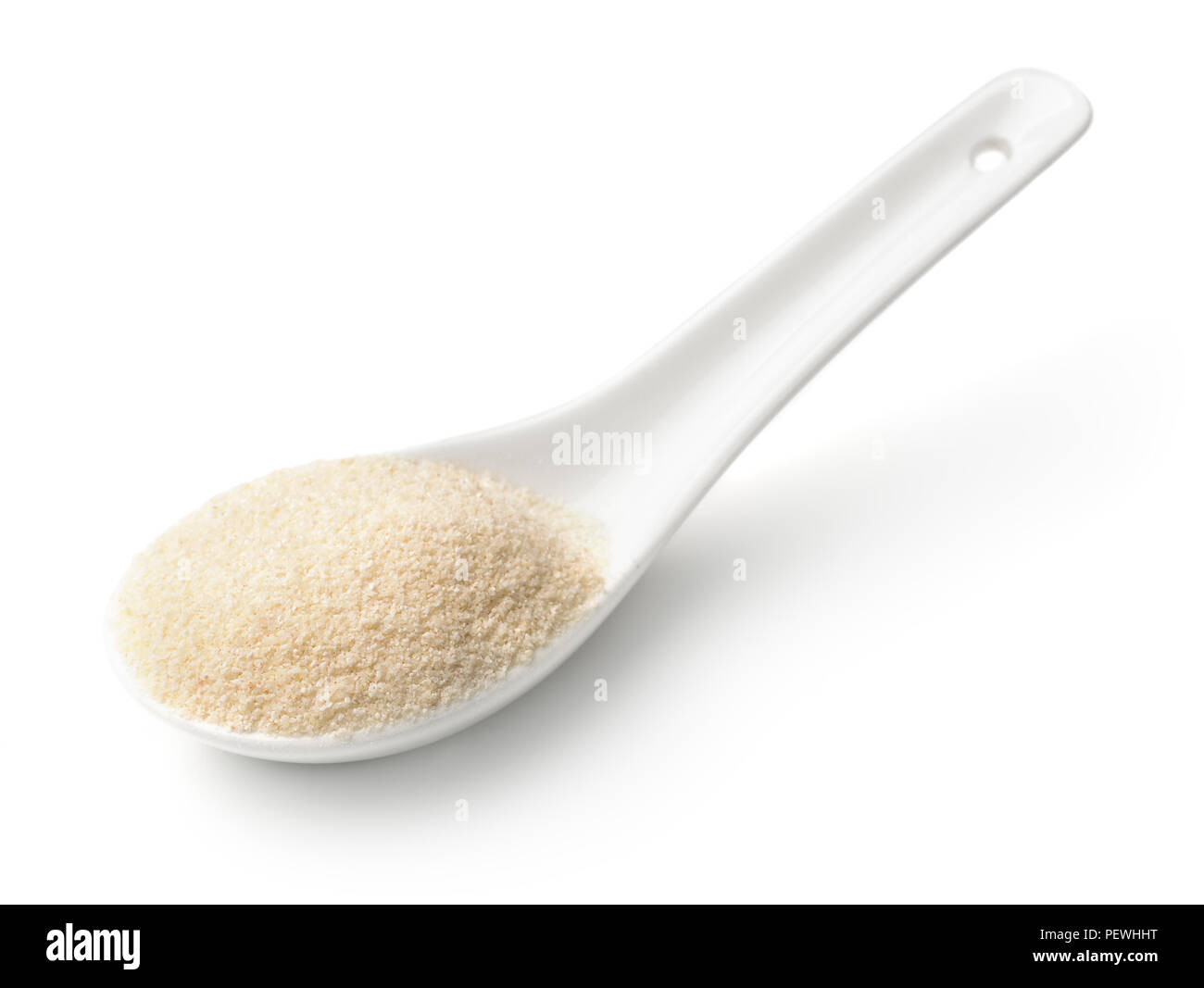 Raw semolina in ceramic spoon isolated on white Stock Photo - Alamy
