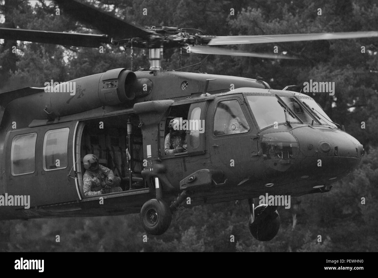 U.S. Army crew chiefs assigned to 16th Combat Aviation Brigade prepare ...