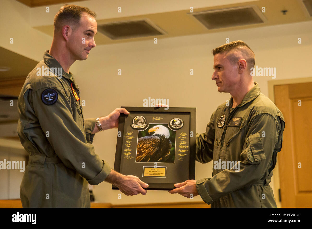 Col. Robert Cooper, left, and Col. James H. Adams hold a plaque to be ...