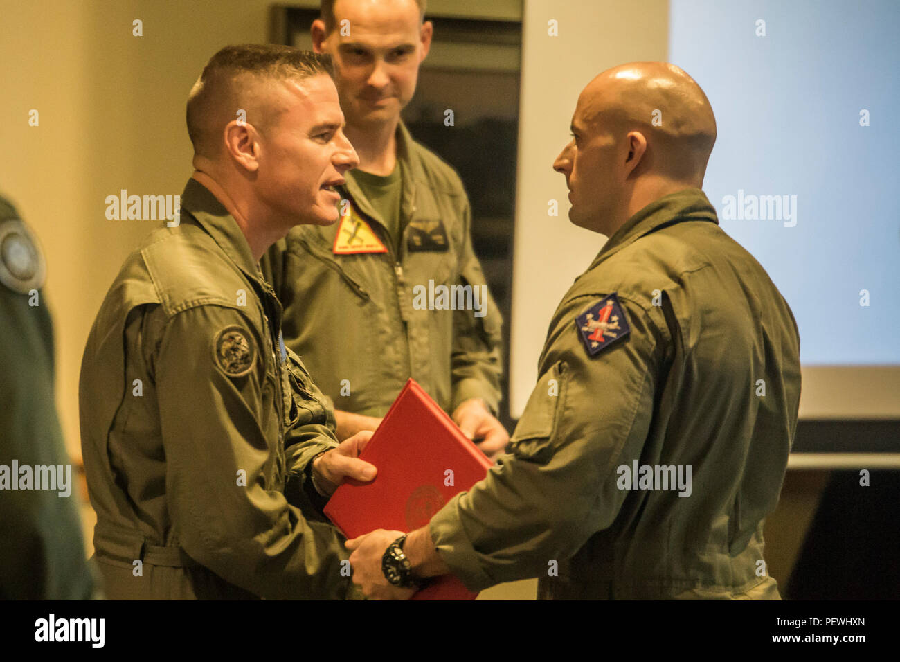 Col. James H. Adams, left, presents a graduation certificate to Capt ...