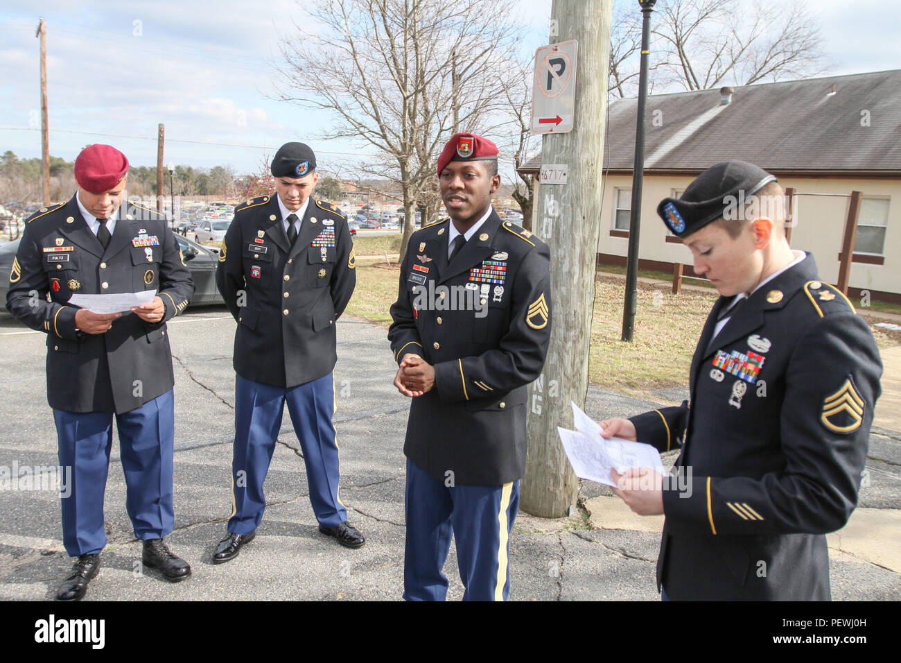 U.S. Army Staff Sgt. Scott Brooks, center, a student in the 25Z Visual ...