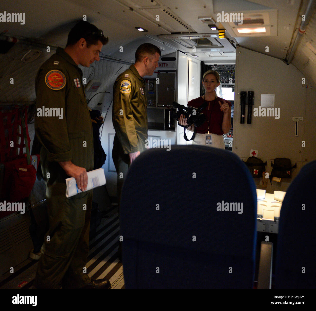 Pilots familiar with the HC-144 Ocean Sentry plane give a tour of the ...