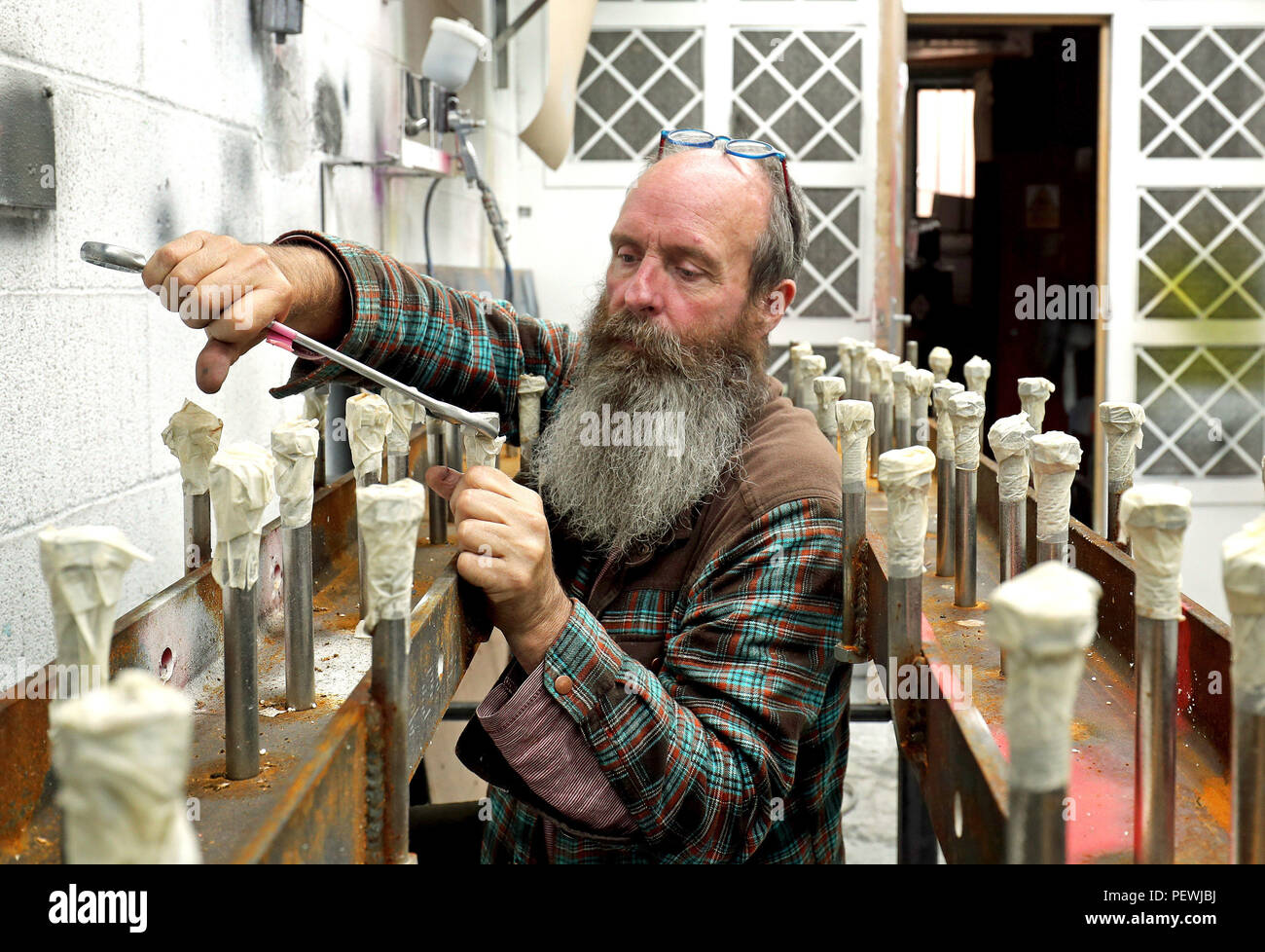 Artist Dave Parfitt at work in his studio in Portslade, East Sussex, as ...