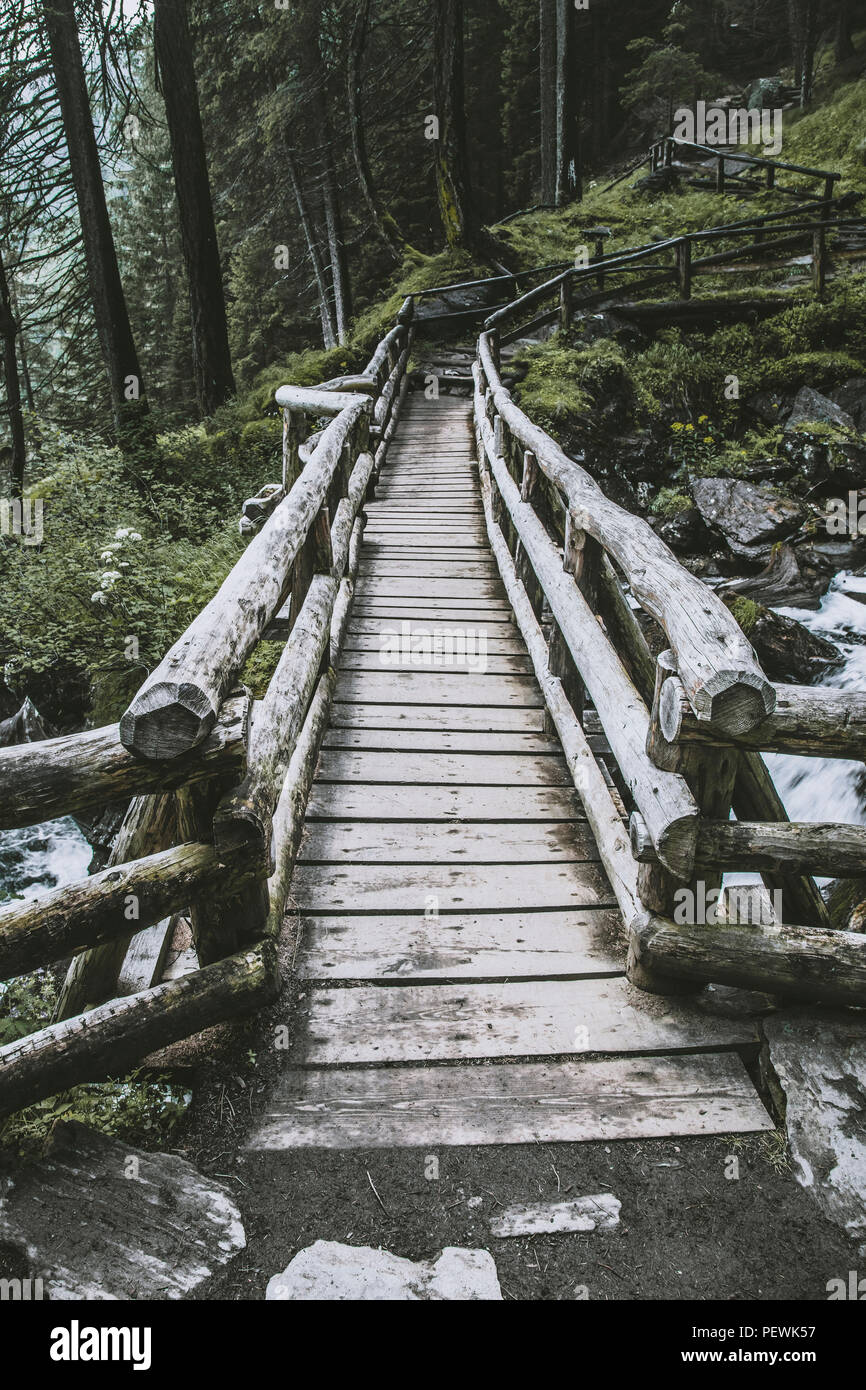 wood bridge near saent waterfall italian alps Stock Photo - Alamy