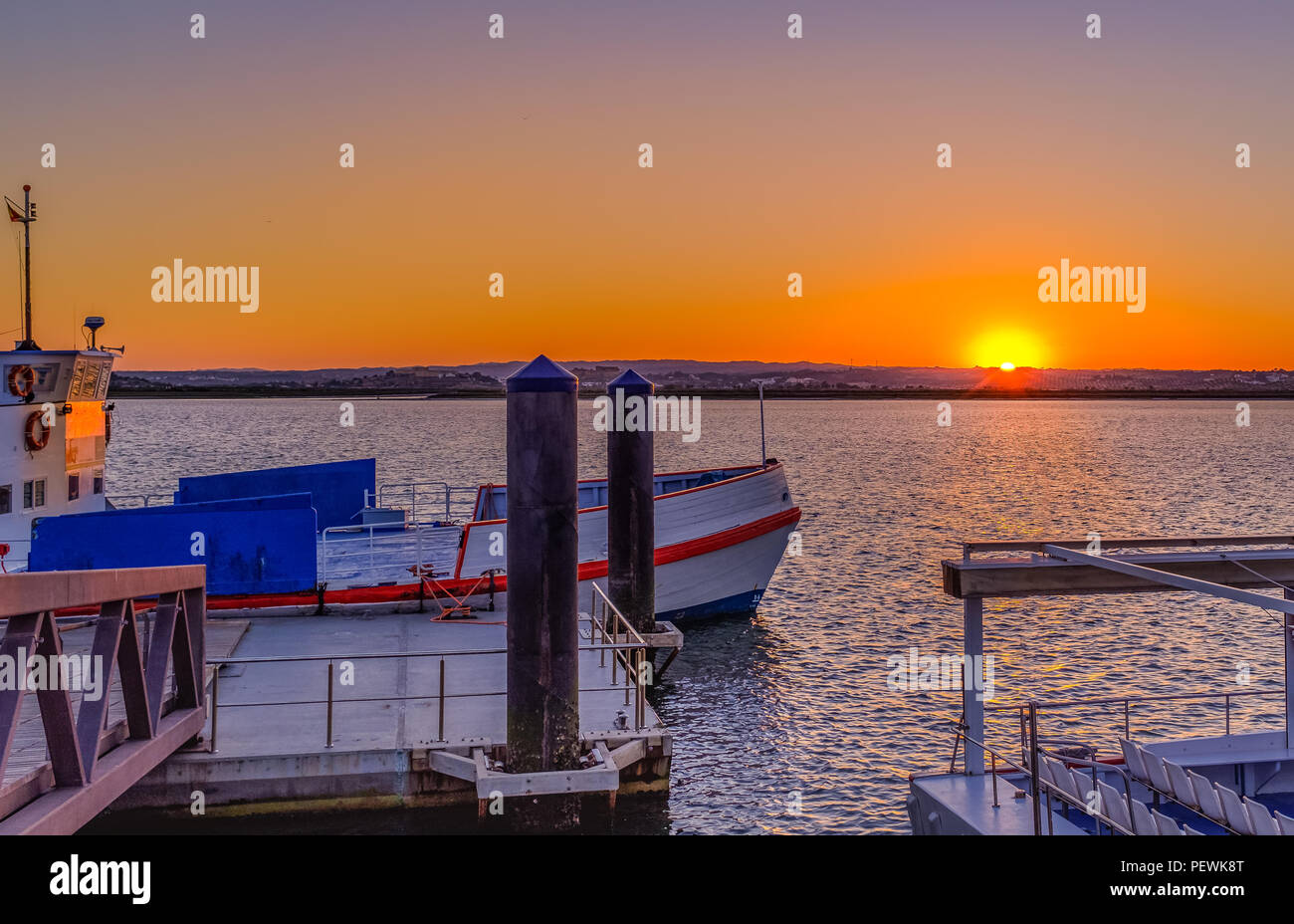 Sunset in Ayamonte over the Algarve across the Guadiana River which ...