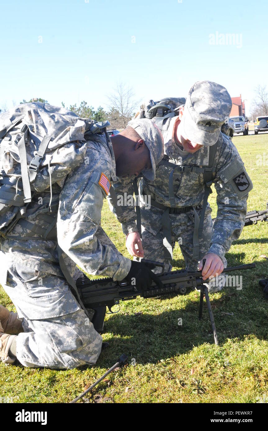 Sgt. Gerard Green (left) and Sgt. Dustin Aycoth work together to field ...