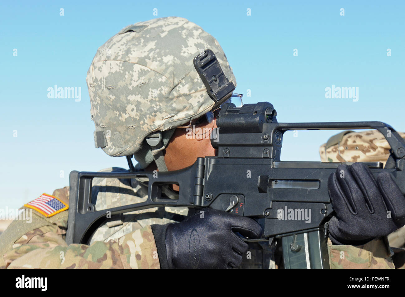 Spc. Kenneth Harris, 93rd Military Police Battalion, looks through the ...