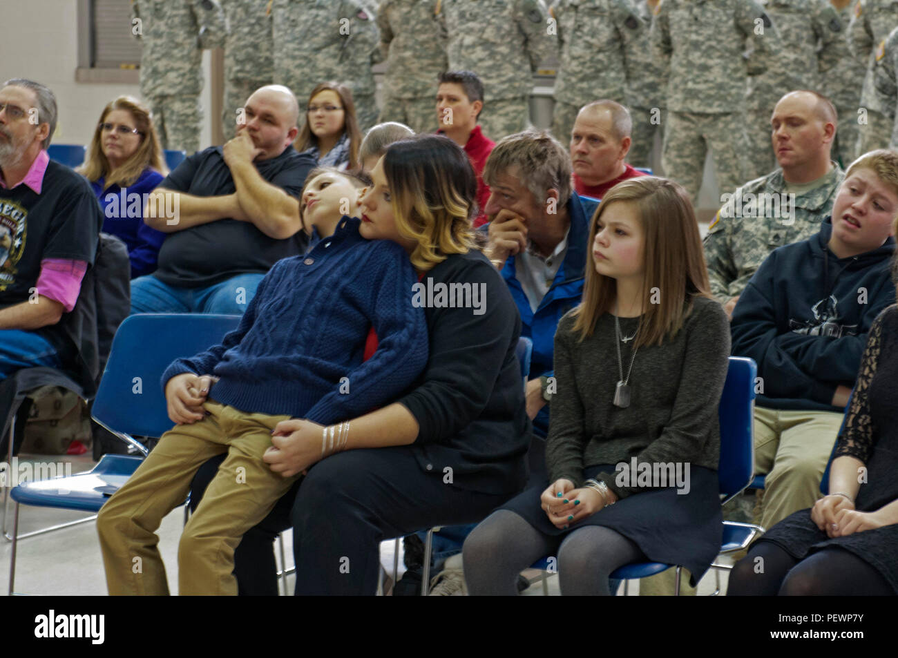 Family members of a fallen soldier from the 983rd Engineer Battalion ...