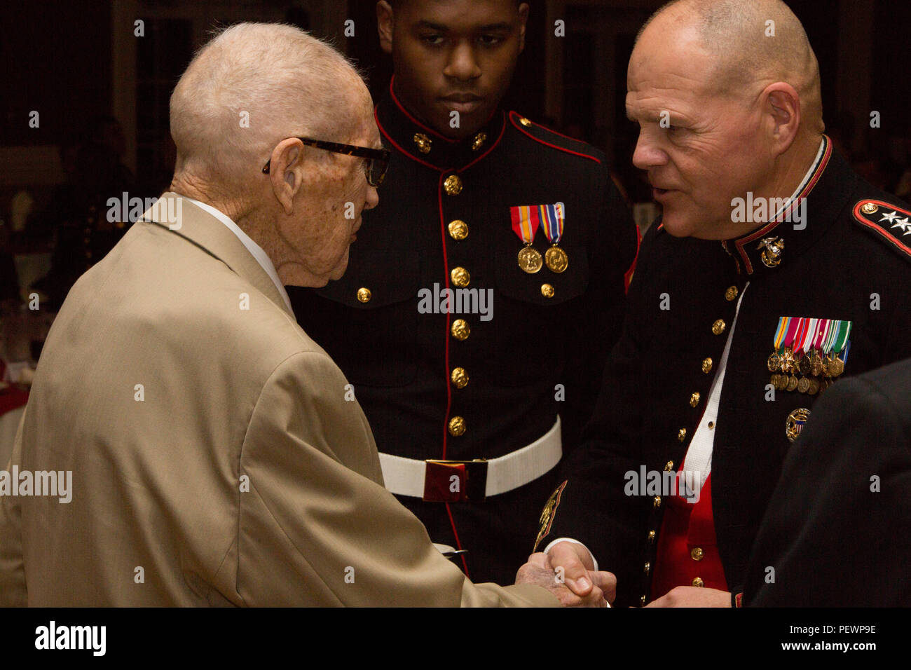 Retired U.S. Marine Corps Sgt. Maj. William F. Steele, left, shakes ...