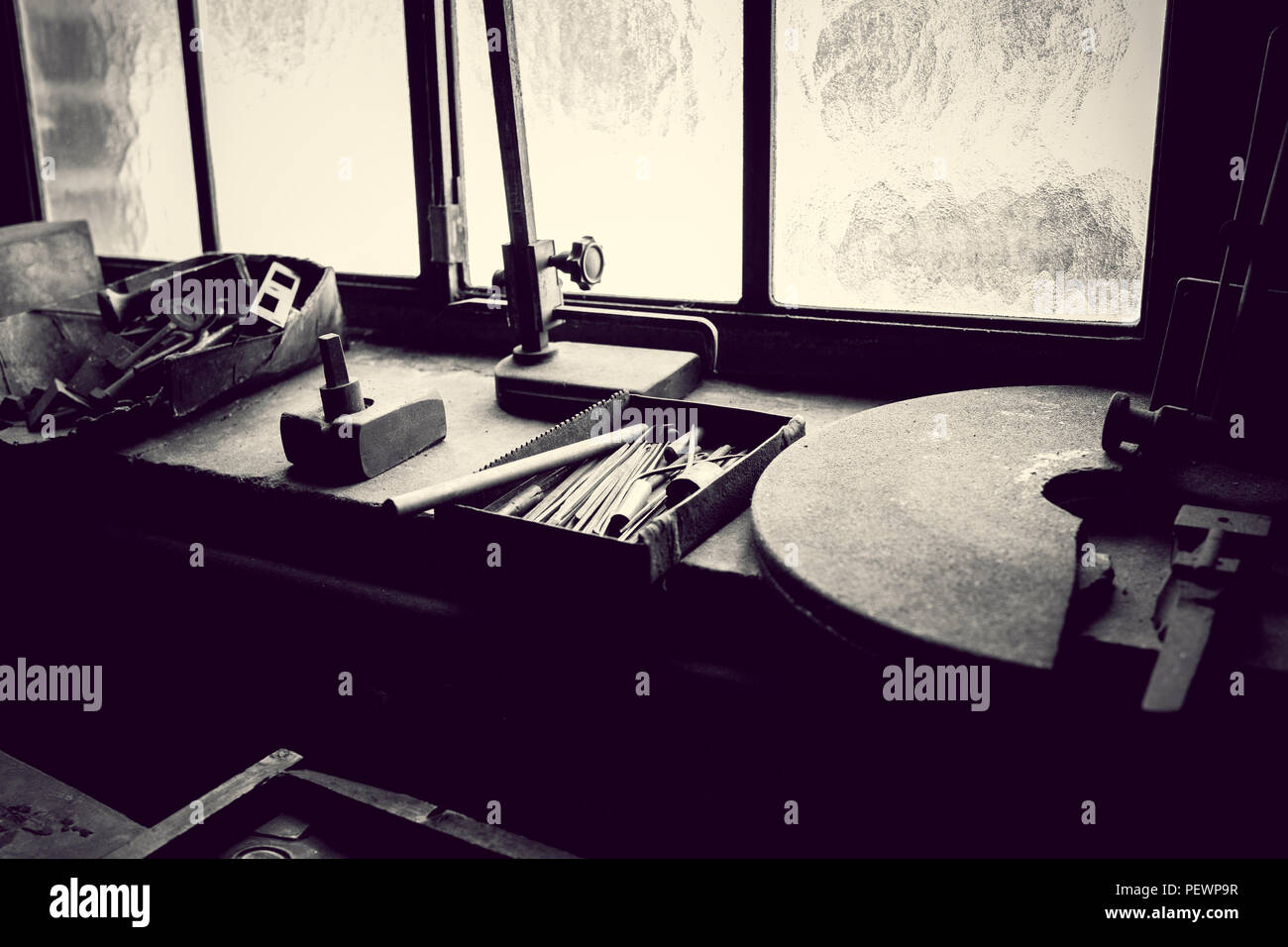 Workplace in an industry museum with gloomy admosphere and window in ...