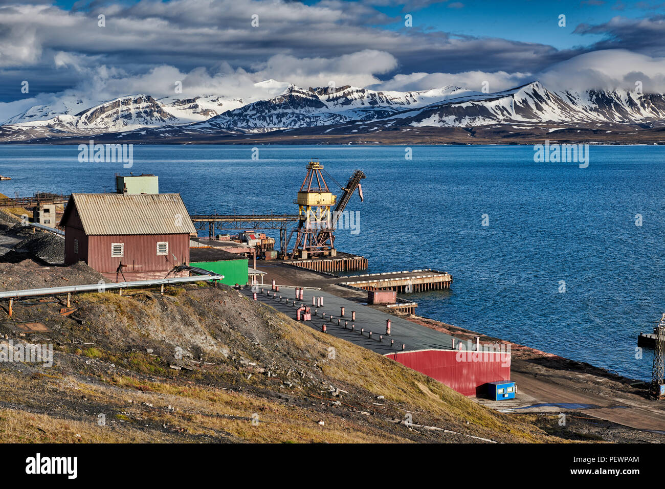 buildings of russian mining town Barentsburg in front of landscape ...