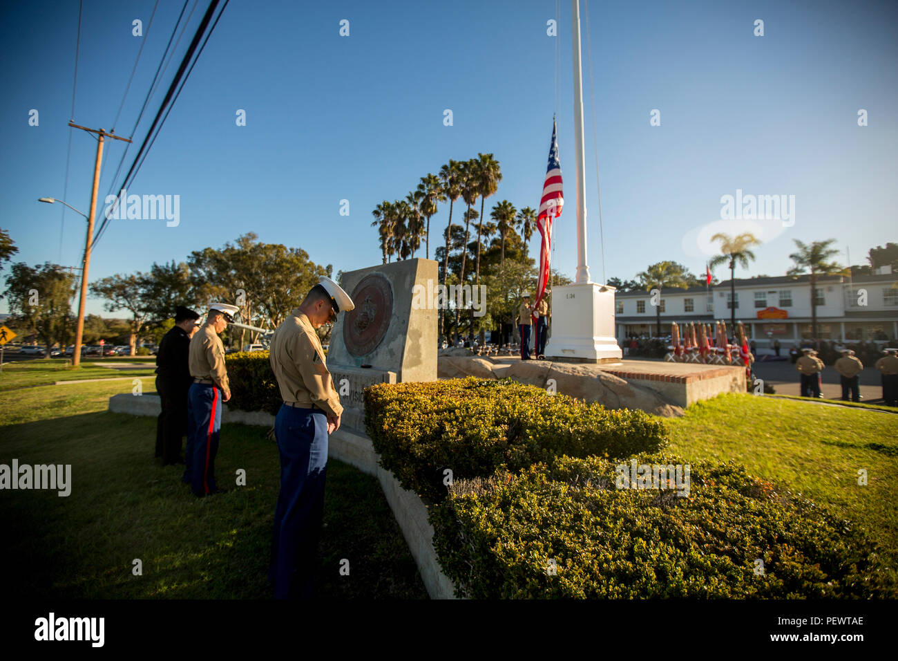 U.S. Marines with the 1st Marine Division stand for the invocation ...
