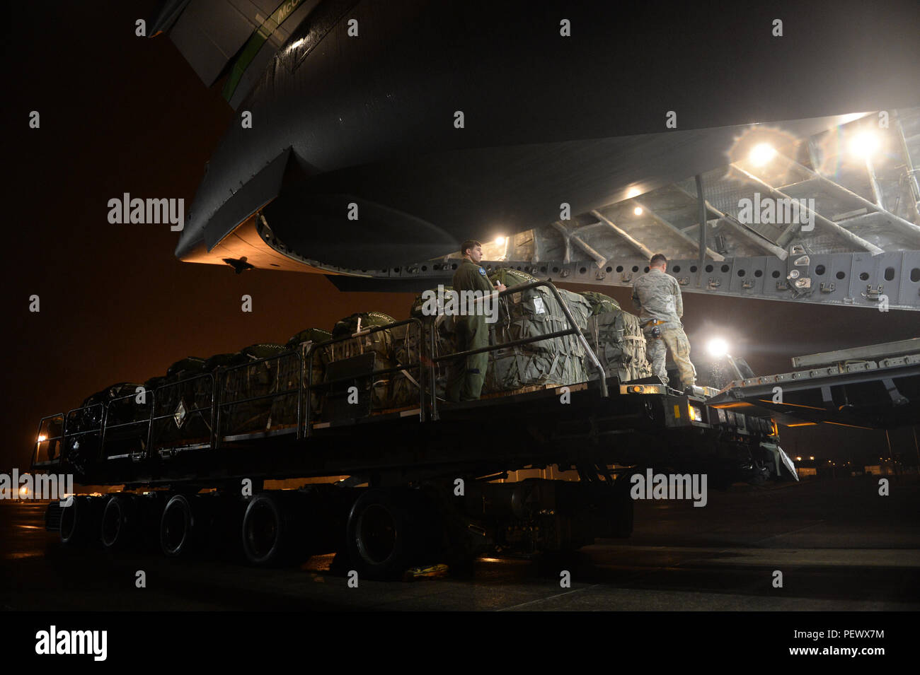 U.S. Air Force Joint Air Drop Inspectors load a C-17 Globemaster III ...