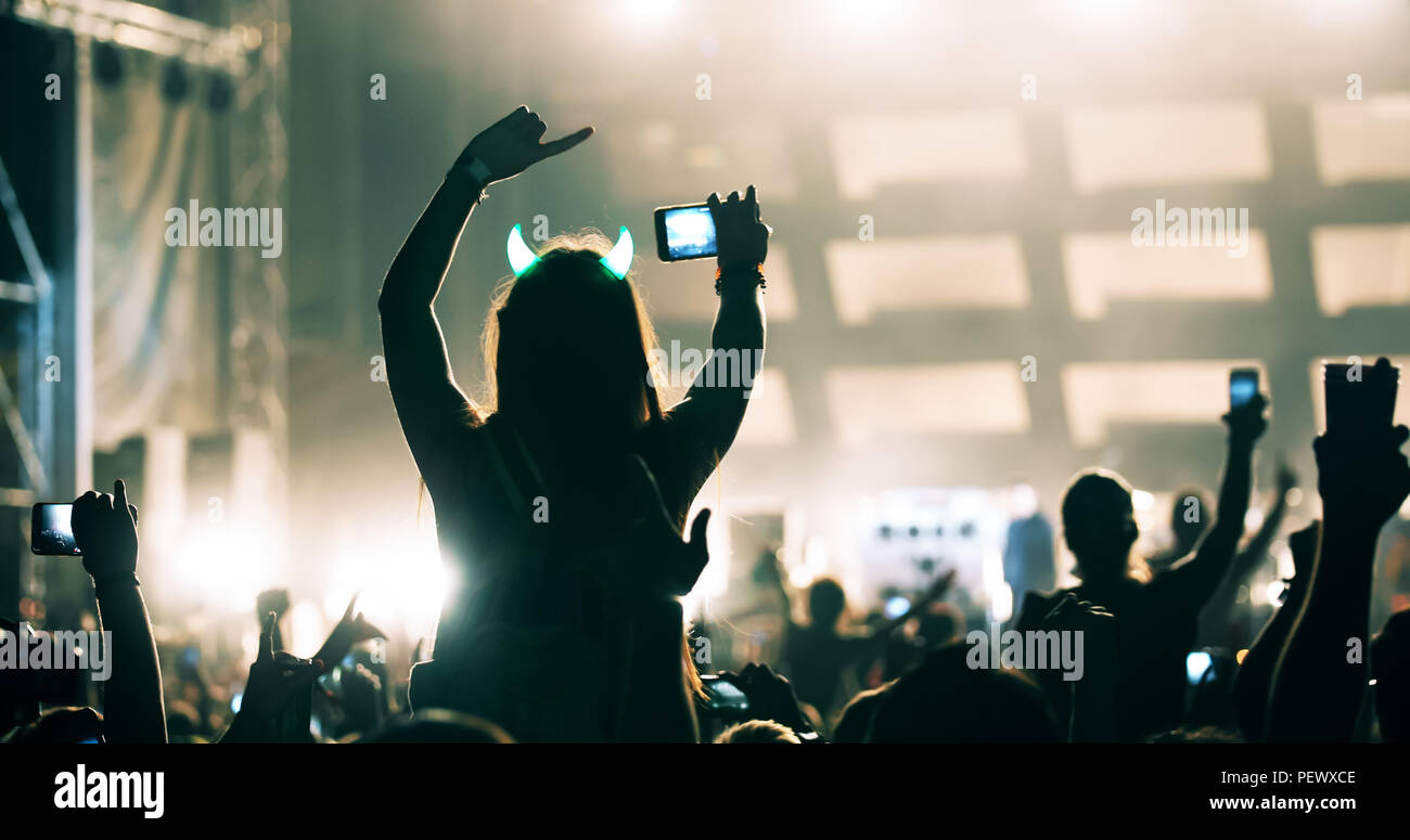 Cheering crowd at concert enjoying music performance Stock Photo - Alamy