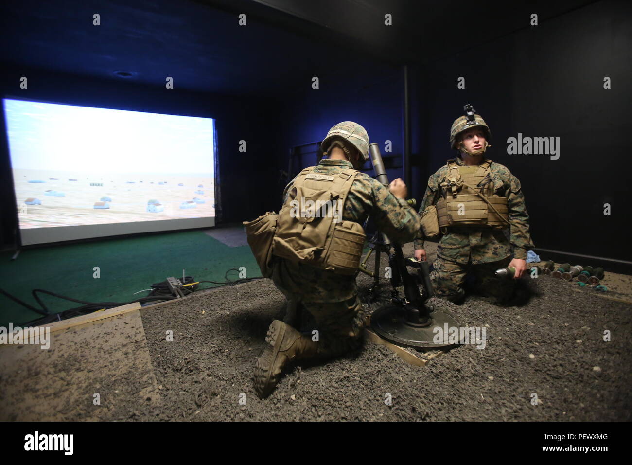 Two Marines conduct simulated mortar fires while training with the ...