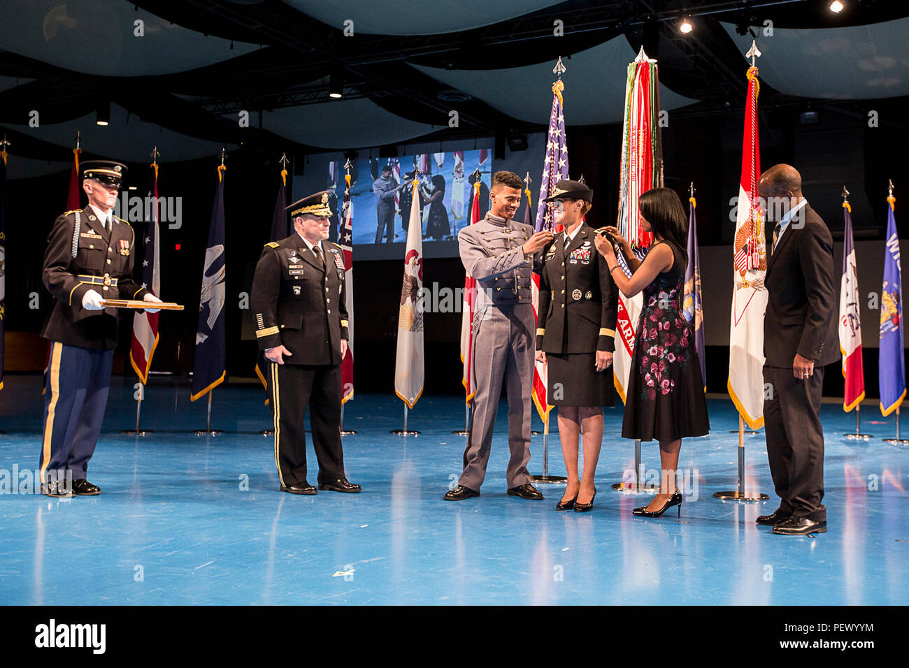 U.S. Army Lt. Gen. Nadja West, center, has her current rank insignia ...