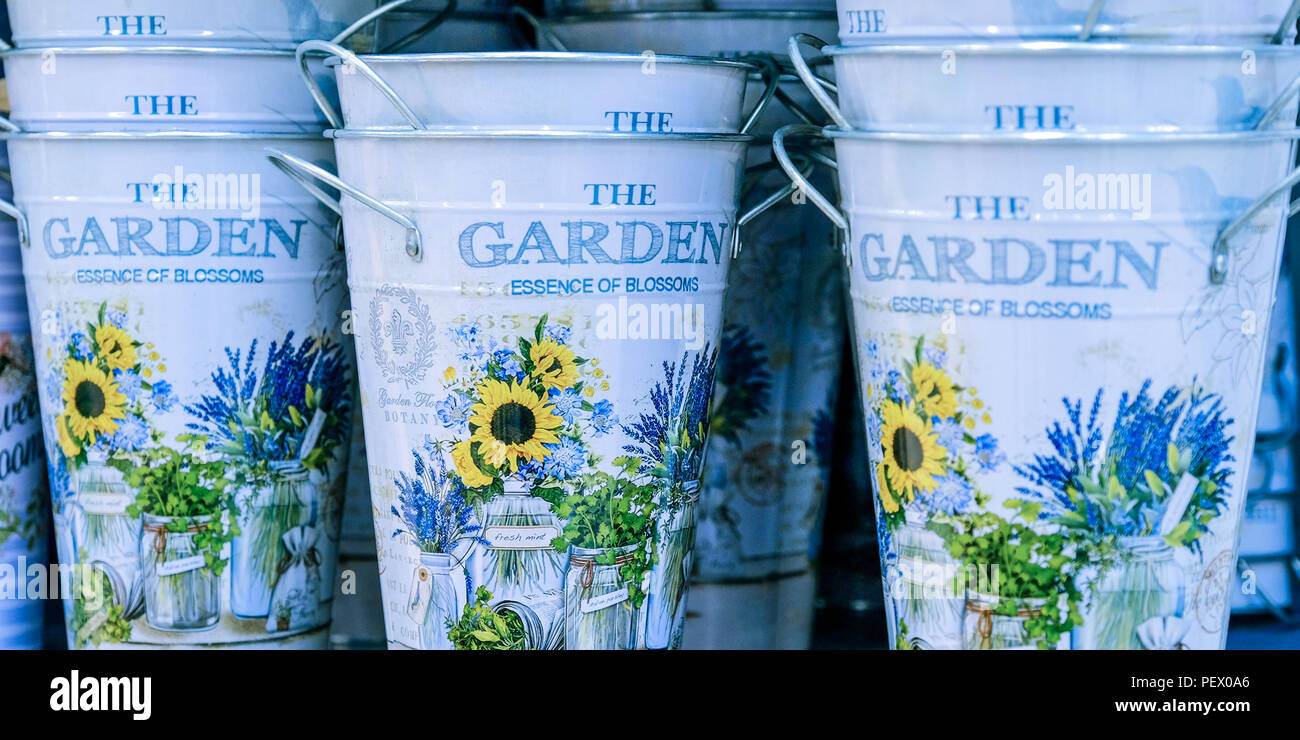 Buckets for flowers. An empty bucket with vintage floral decorations on ...