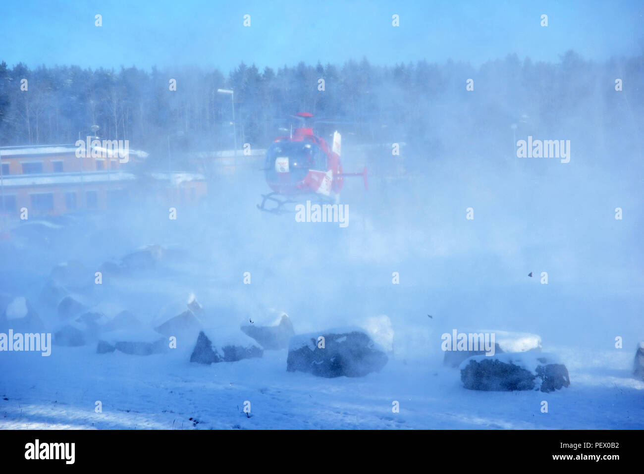 A Eurocopter EC 135 with the German Air Rescue Service lands in front ...