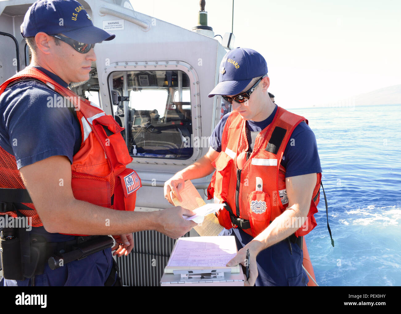 Petty Officer 1st Class Sean Hill and Petty Officer Second Class Andres ...