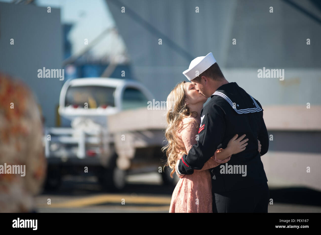 160212-N-BD107-111 SAN DIEGO (Feb. 12, 2016) – A Sailor kisses his wife ...