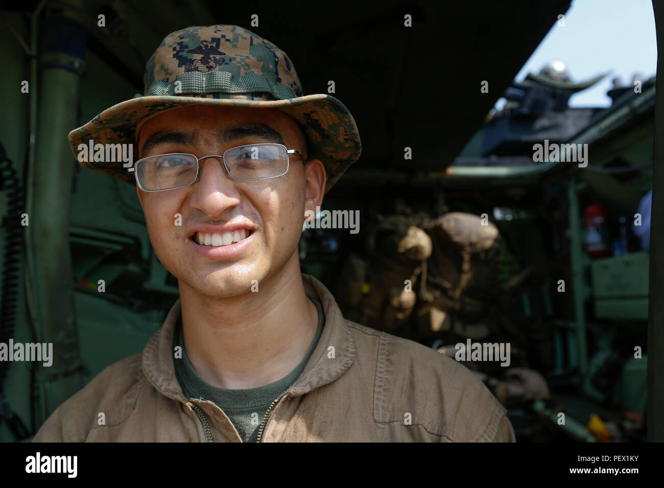 U.S. Marine Corps Lance Cpl. Derick Garcia, an assault amphibious vehicle mechanic with 1st ...