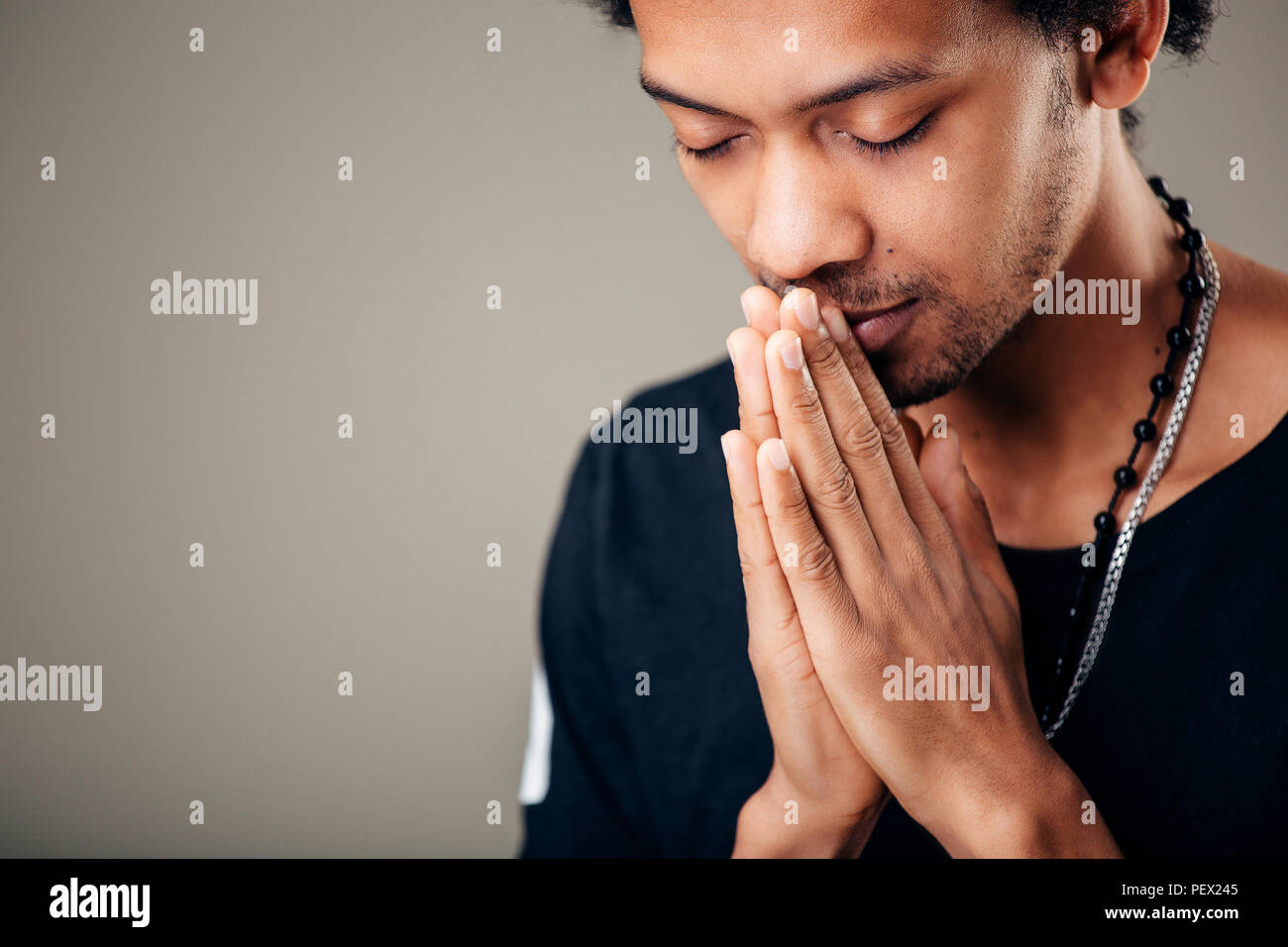 African american boy praying hi-res stock photography and images - Alamy