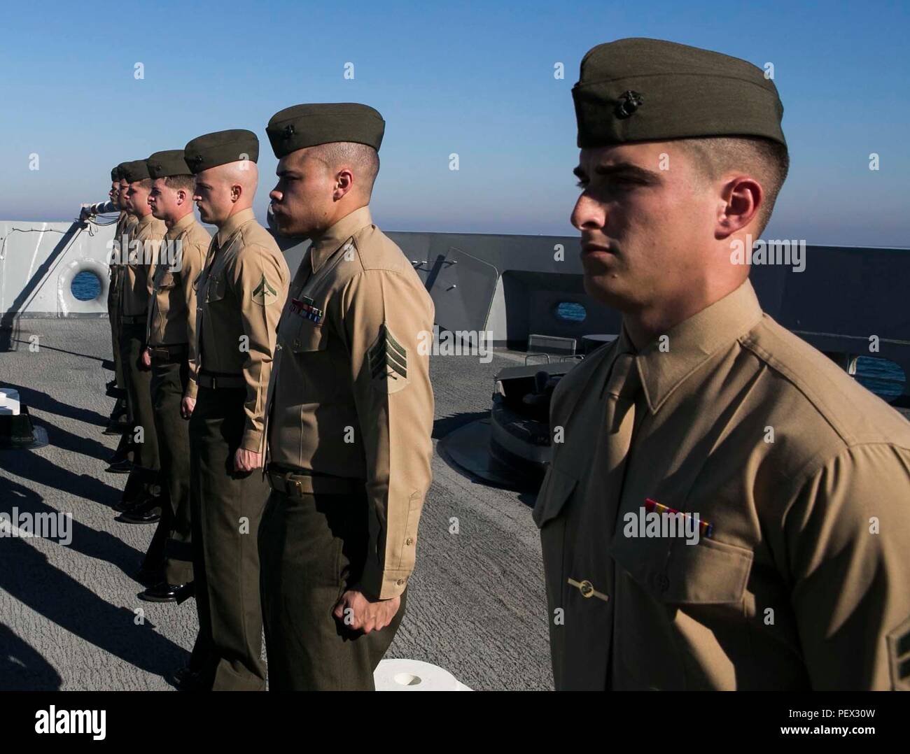 U.S. Marines with the 26th Marine Expeditionary Unit (MEU) stand at the ...
