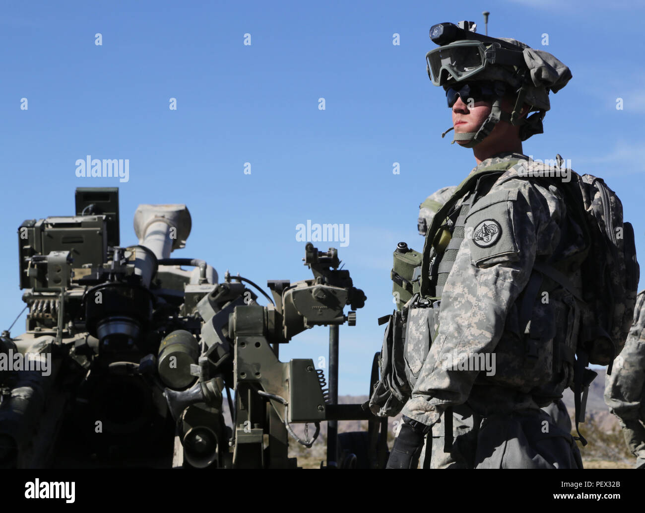 A U.S. Army Soldier assigned to the 3rd Cavalry Regiment stands next to ...