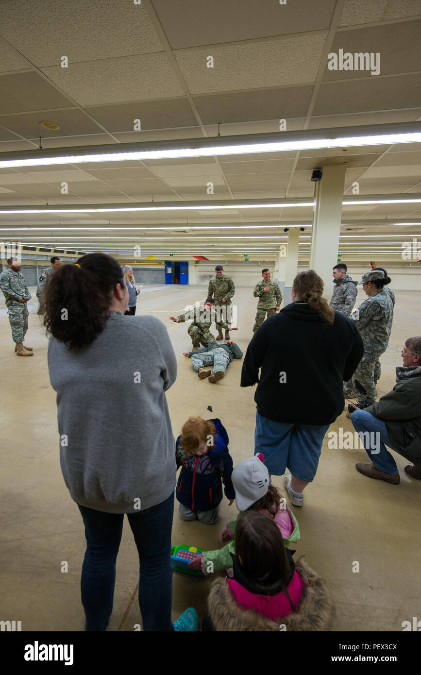 U.S. Army Sgt. 1st Class Bobby Dill, center, assigned to 128th Signal ...